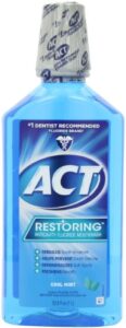 act restoring fluoride mouthwash 33.8 fl. oz. strengthens tooth enamel, cool mint