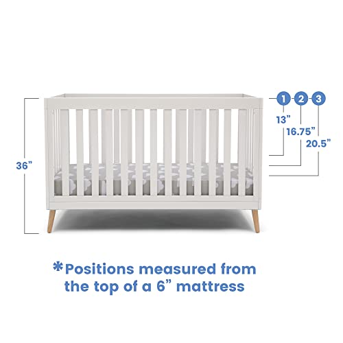 Delta Children Essex 4-in-1 Convertible Baby Crib, Bianca White with Natural Legs