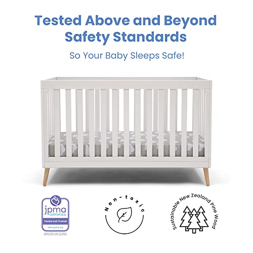 Delta Children Essex 4-in-1 Convertible Baby Crib, Bianca White with Natural Legs