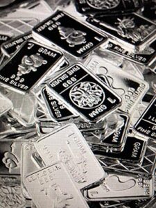 ten one gram .999 pure silver bars with random designs in a jewelry pouch (original version)