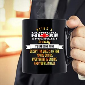 Clinical Nurse Specialist Coffee Mug. Being A Clinical Nurse Specialist Is Easy Like Riding A Bike Except The Bike Is On Fire You're On Fire And In Hell Funny Gifts for Women Men 11 oz black