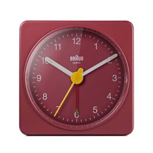 braun classic travel analogue alarm clock, compact size, quiet quartz movement, crescendo beep alarm in red, model bc02r.