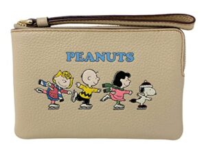 coach x peanuts corner zip wristlet with snoopy and friends motif