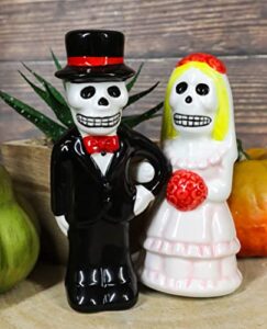 ebros gift day of the dead skeleton couple wedding bride with flowers and groom salt and pepper shakers set ceramic magnetic skulls skeletons kitchen dining bar countertop accessory figurines