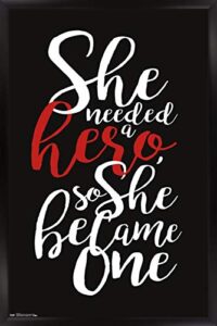 trends international she needed a hero, so she became one wall poster, 14.725″ x 22.375″, black framed version