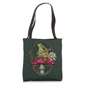 cottagecore aesthetic cute frog on mushroom playing banjo tote bag