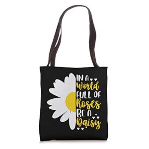 in a world full of roses be a daisy tote bag