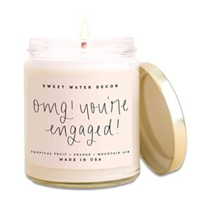 sweet water decor, omg, you’re engaged! | tropical fruits, sugared citrus, mountain green scented soy wax candle for home | engagement gift | 9oz clear jar, 40 hour burn time, made in the usa