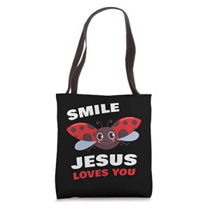 smile jesus loves you – adult & kids ladybug christian faith tote bag