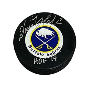 dominik hasek signed buffalo sabres vintage puck – hof 14 – autographed nhl pucks