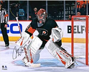 carter hart philadelphia flyers autographed 16″ x 20″ black alternate jersey in net photograph – autographed nhl photos