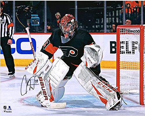 Carter Hart Philadelphia Flyers Autographed 16" x 20" Black Alternate Jersey In Net Photograph - Autographed NHL Photos