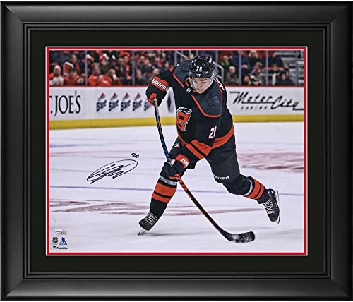 Sebastian Aho Carolina Hurricanes Framed Autographed 16" x 20" Black Alternate Jersey Shooting Photograph - Autographed NHL Photos