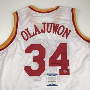 Autographed/Signed Hakeem Olajuwon Houston White Basketball Jersey Beckett BAS COA