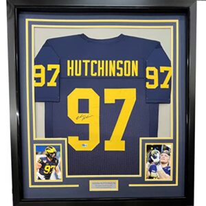 framed autographed/signed aidan hutchinson 33×42 michigan blue college football jersey beckett bas coa