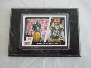 charles woodson michigan state – green bay packers 2021 nfl panini score football”1997 ncaa national champion – collegiate champions” player card mounted on a 4″ x 6″ black marble plaque