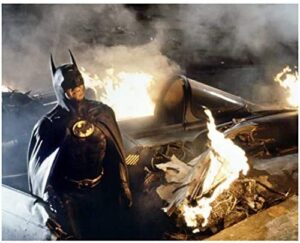 michael keaton as bruce wayne aka batman standing by wrecked batwing 8 x 10 inch photo