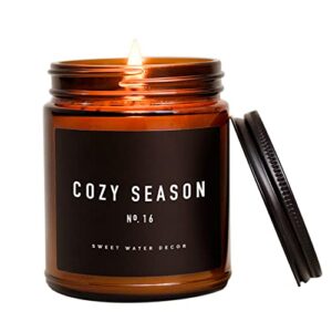 sweet water decor cozy season candle | woods, warm spice, and citrus autumn scented soy candles for home | 9oz amber jar, 40 hour burn time, made in the usa