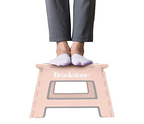 Brookstone BKH1100 9” Folding Step Stool, Non-Slip Textured Grip Surface, Foldable Space Saving Design, Carrying Handle, Holds Up to 300 Pounds, Blush