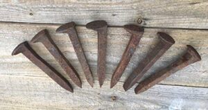 steel railroad spikes. set of 7