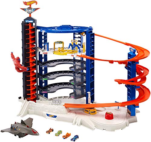 Hot Wheels Toy Car Track Set & 4 1:64 Scale Cars, Super Ultimate Garage, 3+ Ft Tall with Motorized Gorilla & Storage for 140 Cars