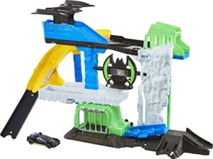 hot wheels dc batcave playset with batman character car in 1:64 scale, toy replica of the batcave with storage