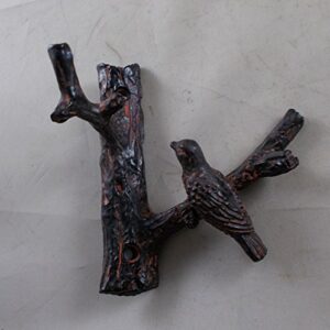 iron coat hook bird on tree branch