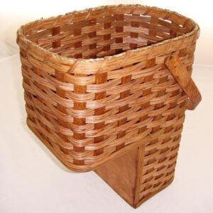 Large 9" stair step basket. Beautifully rests on your stairsteps. Swivel handle, all natural material and made by Old Order Amish. The up splints that are used are on these baskets are oak. Perfect for storing books and magazines. Colors may vary.