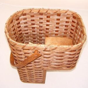 Large 9" stair step basket. Beautifully rests on your stairsteps. Swivel handle, all natural material and made by Old Order Amish. The up splints that are used are on these baskets are oak. Perfect for storing books and magazines. Colors may vary.