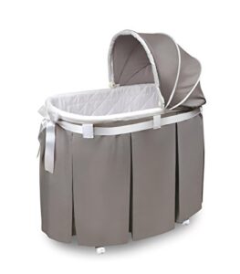 wishes oval rocking baby bassinet with bedding, storage, and pad