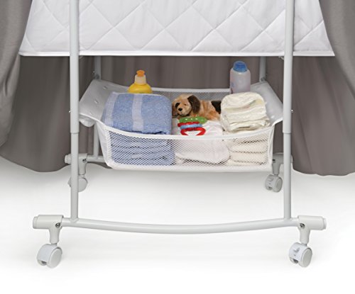 Wishes Oval Rocking Baby Bassinet with Bedding, Storage, and Pad