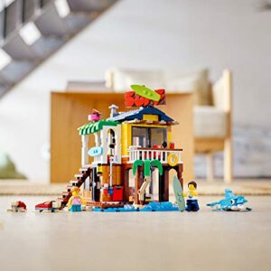 LEGO Creator 3-in-1 Surfer Beach House 31118 - Featuring Lighthouse, Pool House, Boat, 2 Minifigures, Dolphin Figure, Great Summer Building Toy Set for Kids, Girls, and Boys Ages 8+