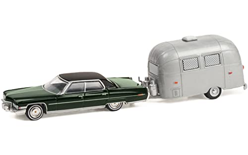 1972 Sedan DeVille Brewster Green Met. w/Black Top & Airstream 16’ Bambi Travel Trailer Hitch & Tow 1/64 Diecast Model Car by Greenlight 32240 A