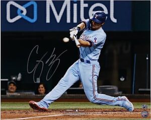 corey seager texas rangers autographed 16" x 20" blue jersey swing photograph - autographed mlb photos