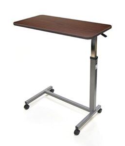 invacare hospital style overbed table with auto-touch adjustable height and wheels, fits over beds and bedside, 6417 brown .75"h x 15"w x 30"l,base: 15.5"w x 26"l,28" - 40"