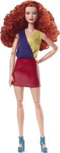 barbie looks doll with curly red hair dressed in color block top and glossy pleather skirt, posable made to move body