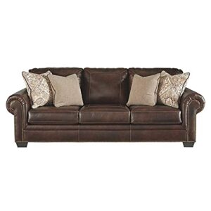 signature design by ashley roleson traditional leather queen sofa sleeper with nailhead trim and 4 accent pillows, brown