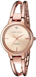 anne klein women's ak/2626rgrg diamond-accented dial rose gold-tone open bangle watch