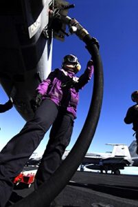 posterazzi pacific ocean january 28 2007-aviation boatswain's mate airman fuels prior to launch aboard nimitz-class aircraft carrier uss john c. stennis. s poster print, (22 x 33)