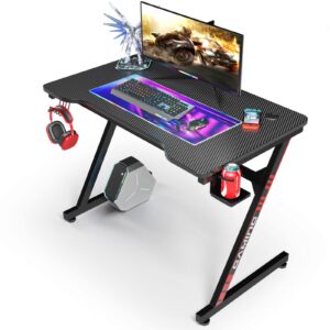 FLEDEX Gaming Desk, 40 inch Carbon Fiber Gamer PC Computer Desk, Sturdy Design Home Office Workstation Gaming Table with Foldable Cup Holder and Headphone Hook, Black