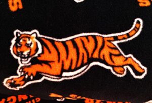 1-1/2 yard (54 inches) x 56 inches - tigers tossed on black fleece fabric (great for blankets, throws, sewing, craft projects, and more) 1-1/2 yard x 56 inches