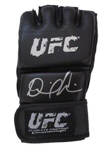 daniel cormier autographed ufc distress fight glove w/proof, picture of daniel signing for us, ultimate fighting championship, sherdog, ufc heavyweight, strikeforce, oklahoma state cowboys