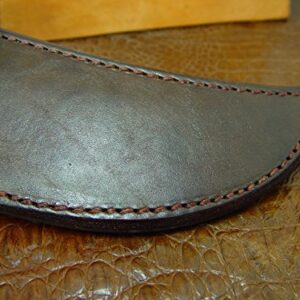 Custom-made Cross Draw Knife Sheath for the Buck Kalinga 401 Knife. The Sheath Is Made Out of 10 Ounce Water Buffalo Hide Leather. The 10 oz. Leather is Dyed Dark Brown. The Sheath Also Has a Strap for Extra Security of Your Knife From Falling Out. The Sh