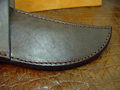 Custom-made Cross Draw Knife Sheath for the Buck Kalinga 401 Knife. The Sheath Is Made Out of 10 Ounce Water Buffalo Hide Leather. The 10 oz. Leather is Dyed Dark Brown. The Sheath Also Has a Strap for Extra Security of Your Knife From Falling Out. The Sh