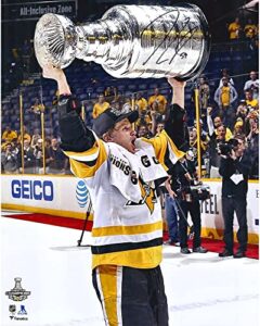 jake guentzel pittsburgh penguins 2017 stanley cup champions autographed 16" x 20" raising cup photograph - autographed nhl photos