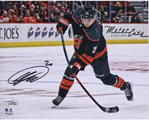 sebastian aho carolina hurricanes autographed 8" x 10" black alternate jersey shooting photograph - autographed nhl photos