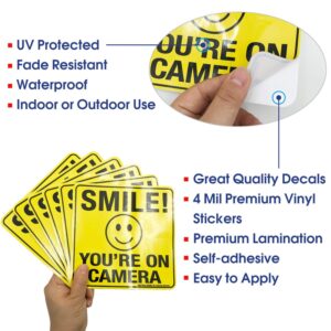 Smile You're On Camera Sign Stickers 6 Pack - 6 x 6 Inches- 4 Mil Vinyl - Laminated for Ultimate UV, Weather, Scratch, Water and Fade Resistance - Easy To Stick - Use for CCTV Security Camera