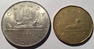 real canadian dollar set old large voyager canoe and new small loonie