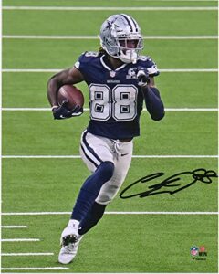 ceedee lamb dallas cowboys autographed 8" x 10" vertical running photograph - autographed nfl photos