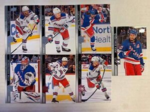 2020-21 upper deck series one new york rangers veteran team set (no young guns) which includes the following cards tony deangelo, adam fox, artemi panarin, igor shesterkin, marc staal, jacob trouba, and mika zibanejad